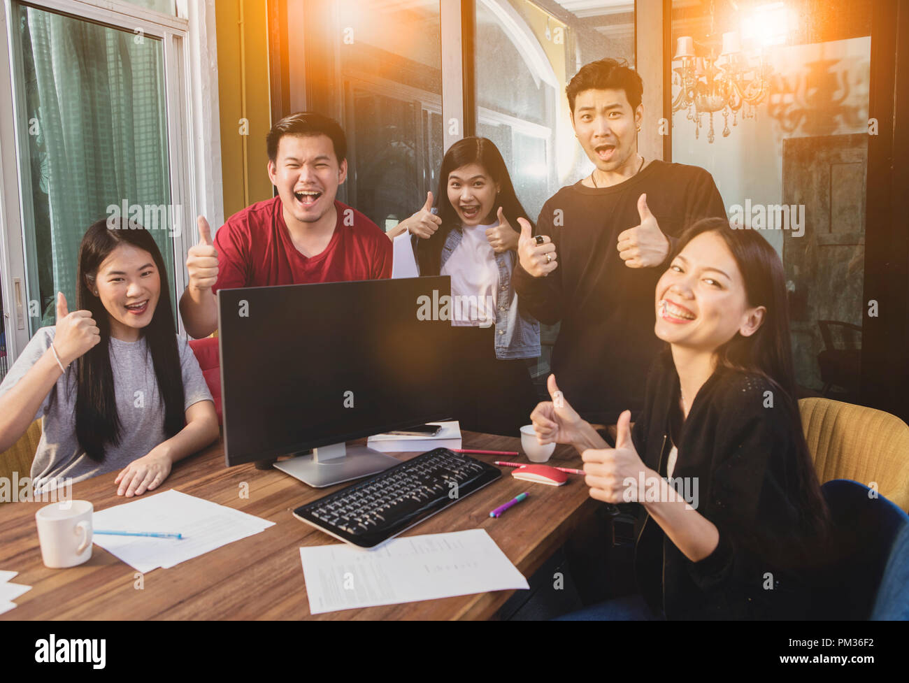 group of asian younger freelancing team work happiness emotion in home ...