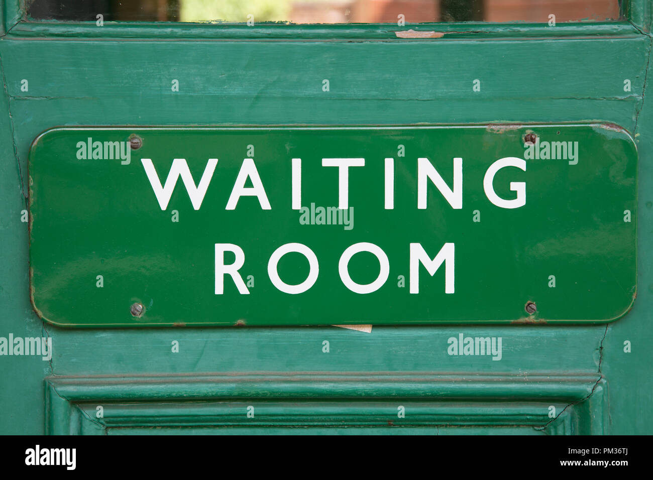 Green Waiting Room Sign on Door Stock Photo - Alamy