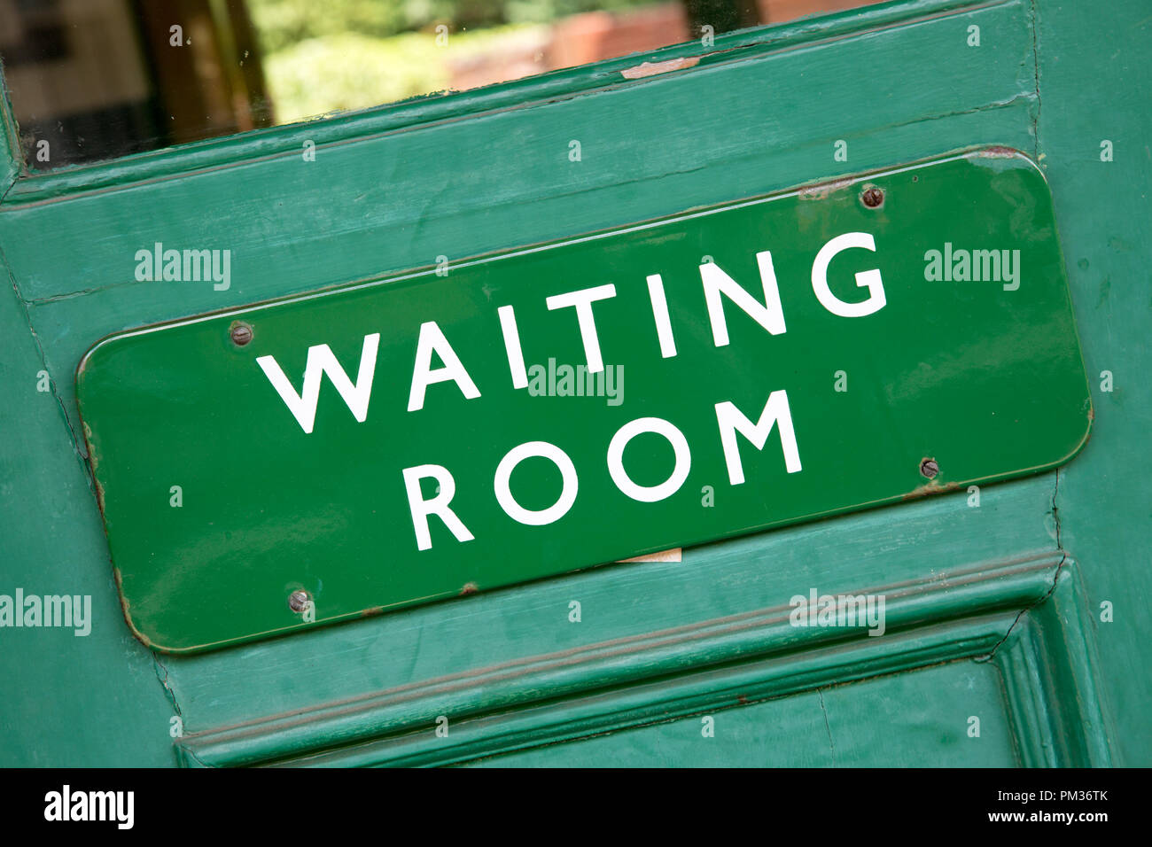 Green Waiting Room Sign on Diagonal Slant Stock Photo - Alamy