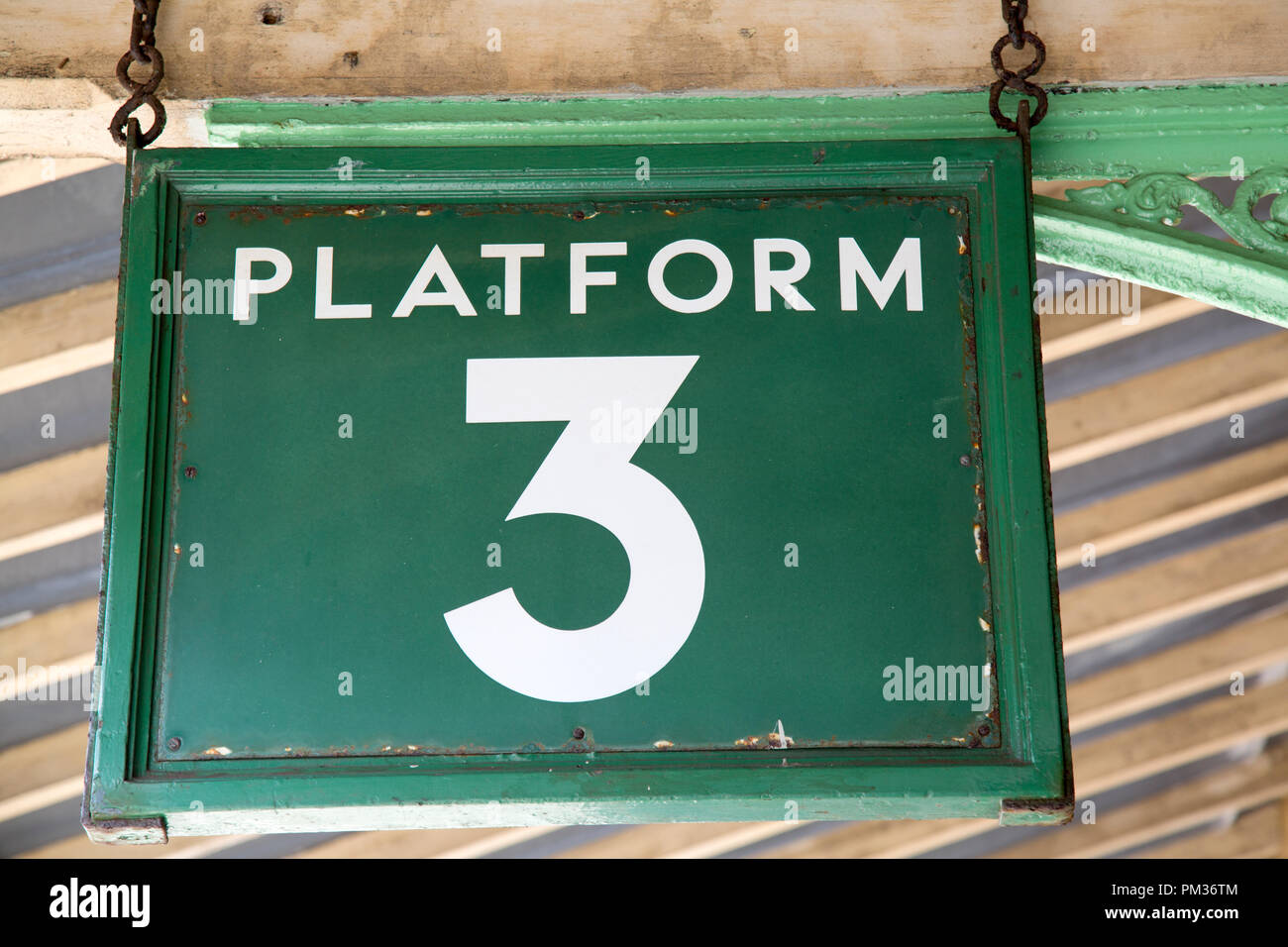 Hanging Green Platform Three Sign Stock Photo - Alamy