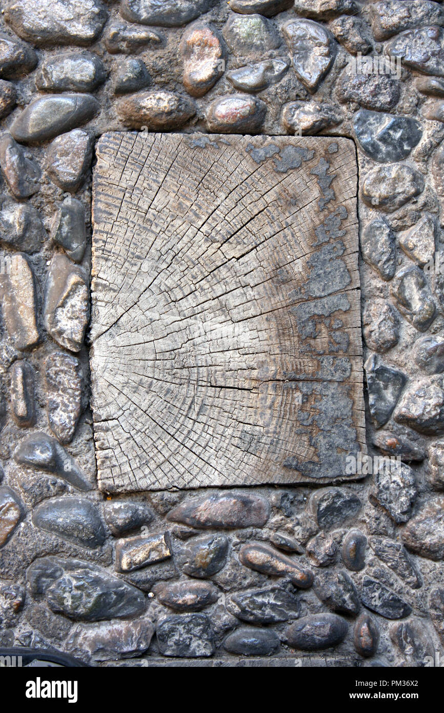 Old wooden plank in ancient paving stone Stock Photo - Alamy