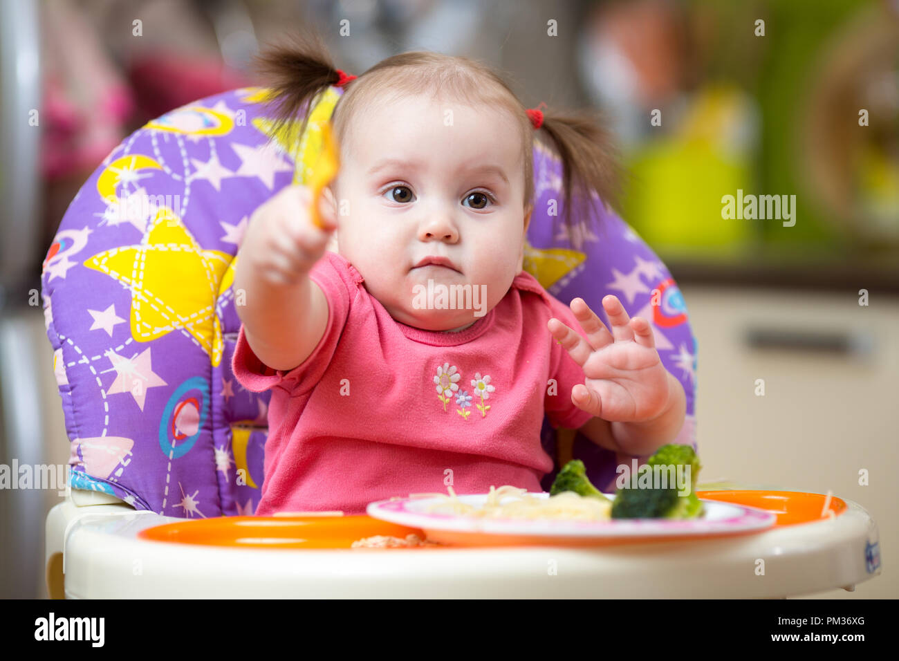 baby child eating in chair Stock Photo - Alamy