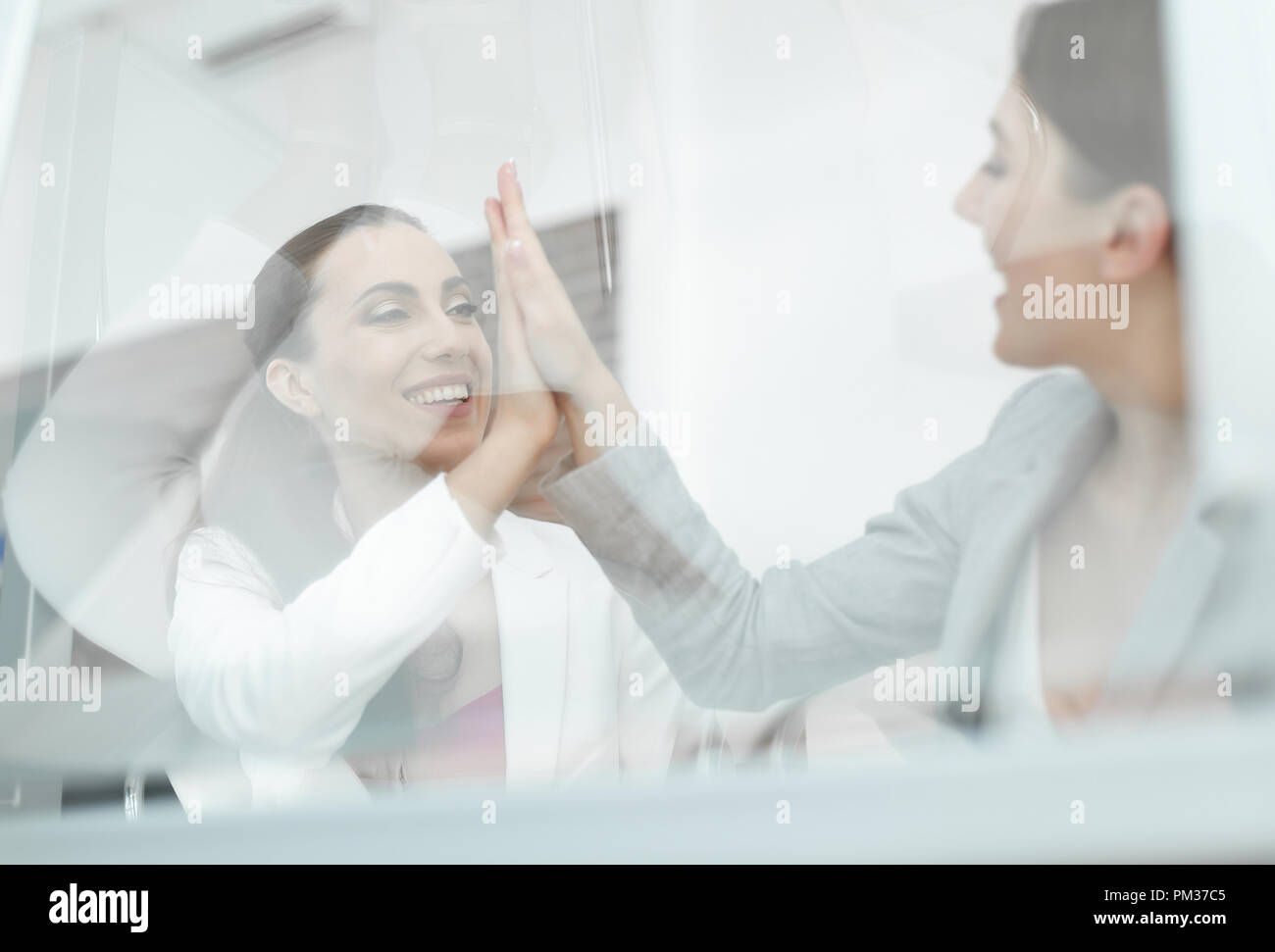 behind the glass.business team is the winner. startup Stock Photo - Alamy