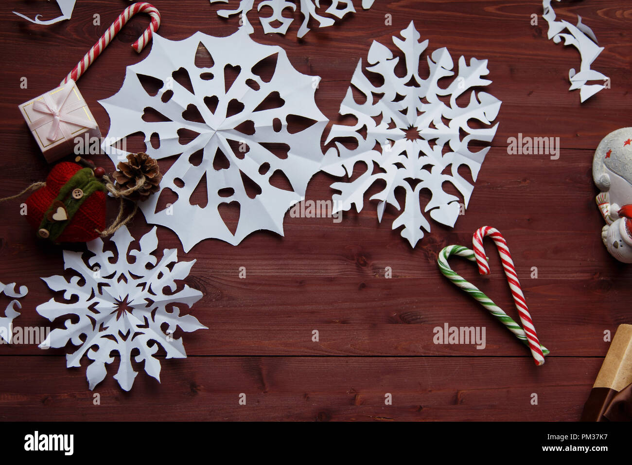 New Year's Christmas concept. Snowflakes cut from paper, gifts ...