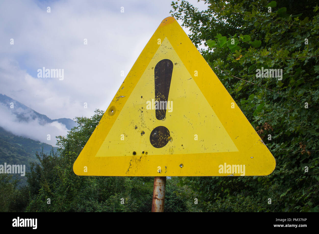 shot up danger warning traffic/road sign, pierced, shoot, August 28 ...