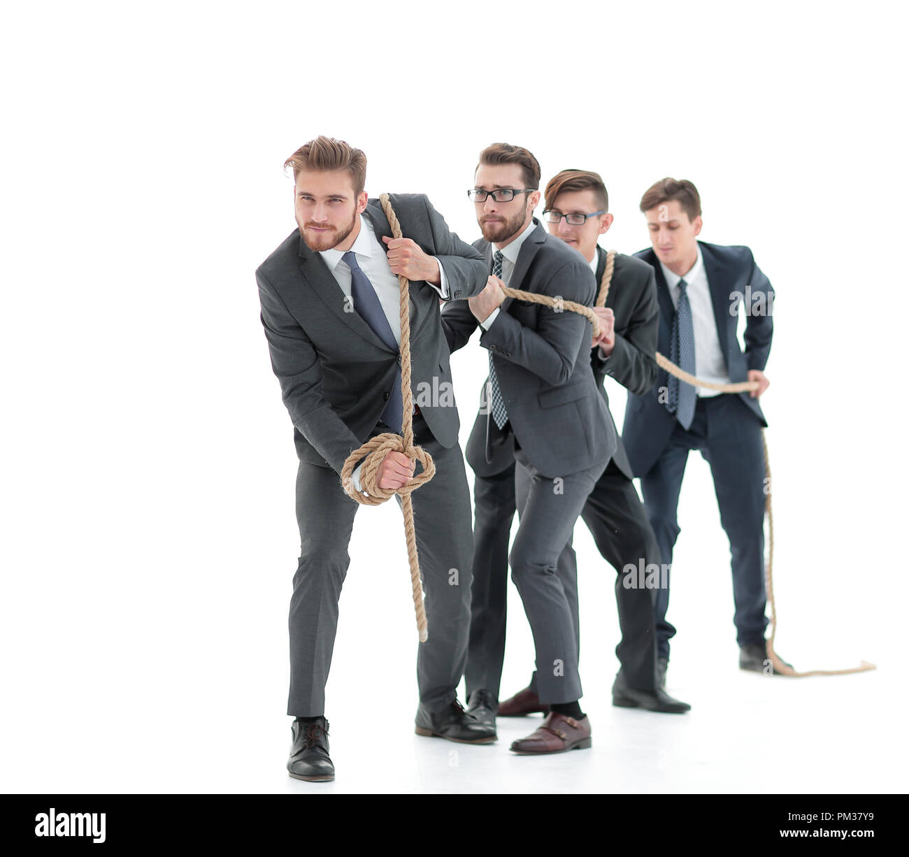 closeup.smiling business team pulls the rope Stock Photo - Alamy