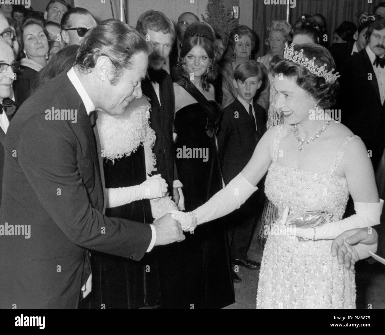 Rex Harrison is presented to the Queen of England (Queen Elizabeth) at ...