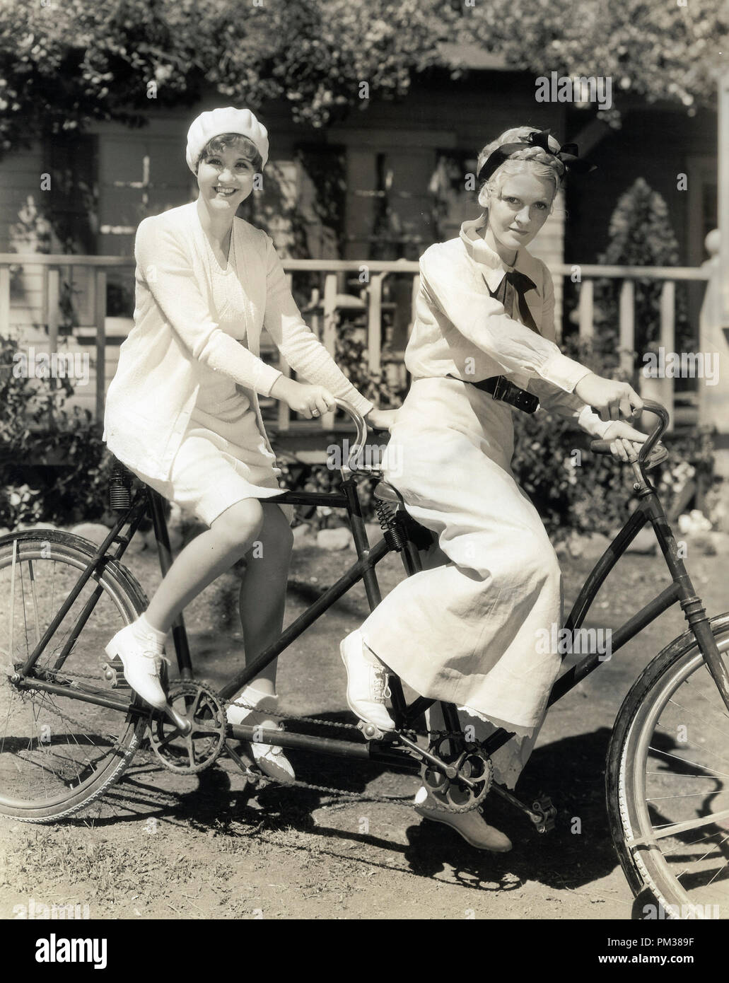 Silent film scene still. Two ladies on a tandem Bicycle, 1930. File ...