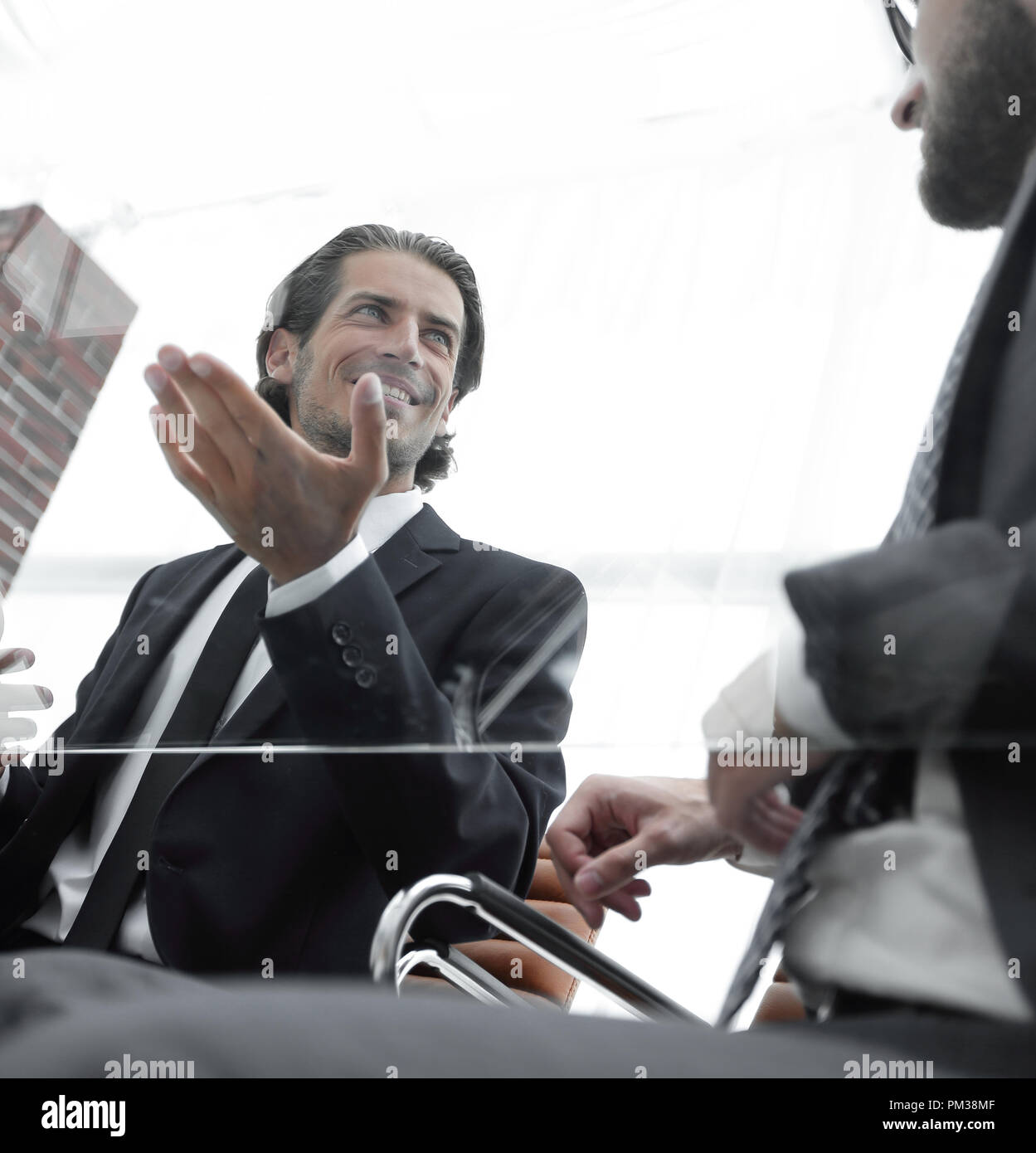 business partners sitting at a Desk Stock Photo - Alamy