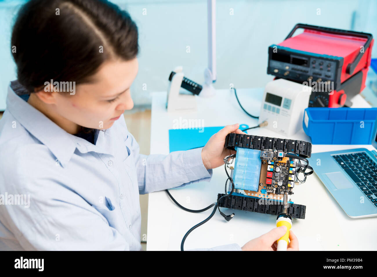 Young woman in CNC and robotics laboratory Stock Photo - Alamy