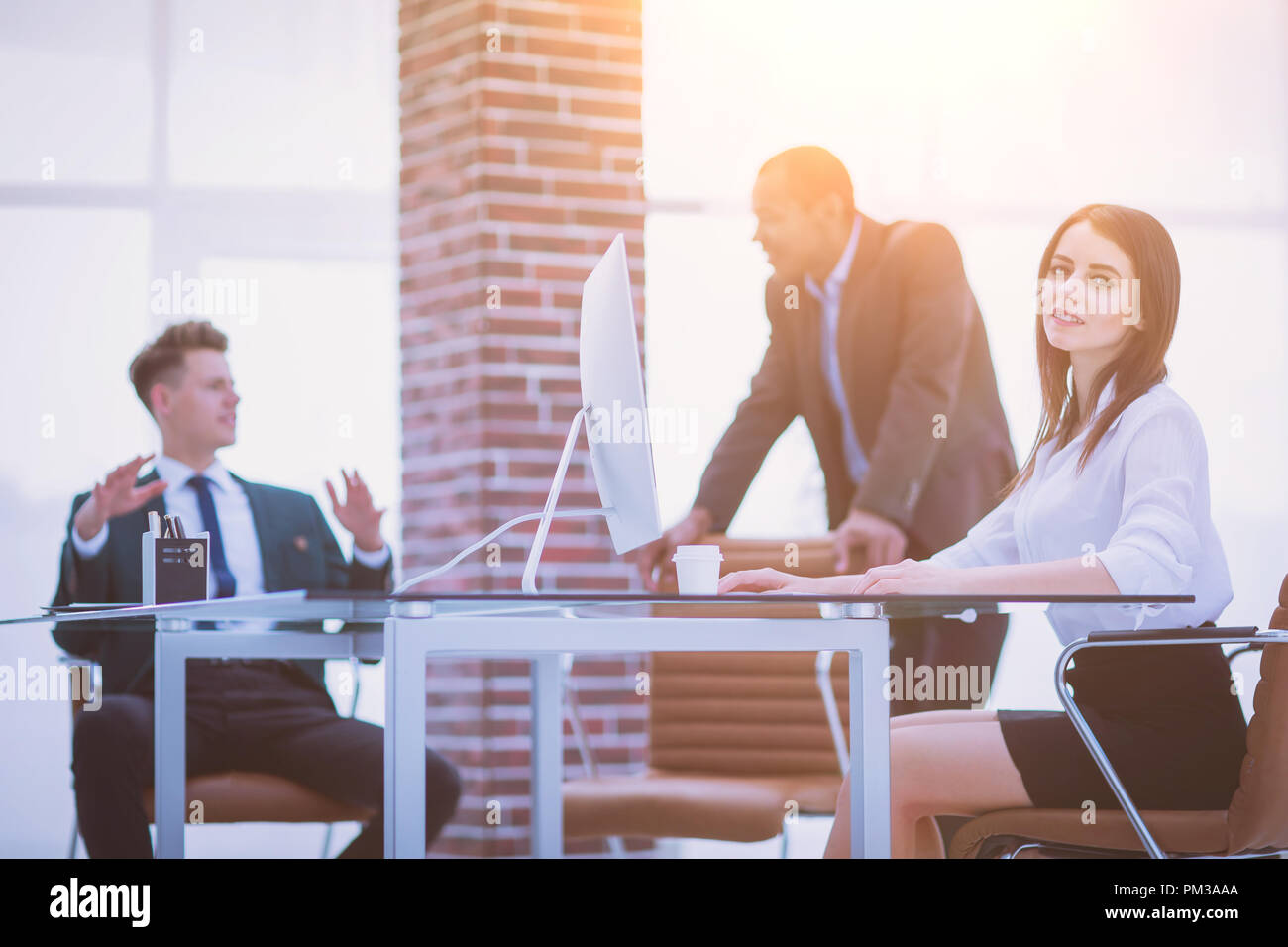 Executive business woman in office on the background of business team ...
