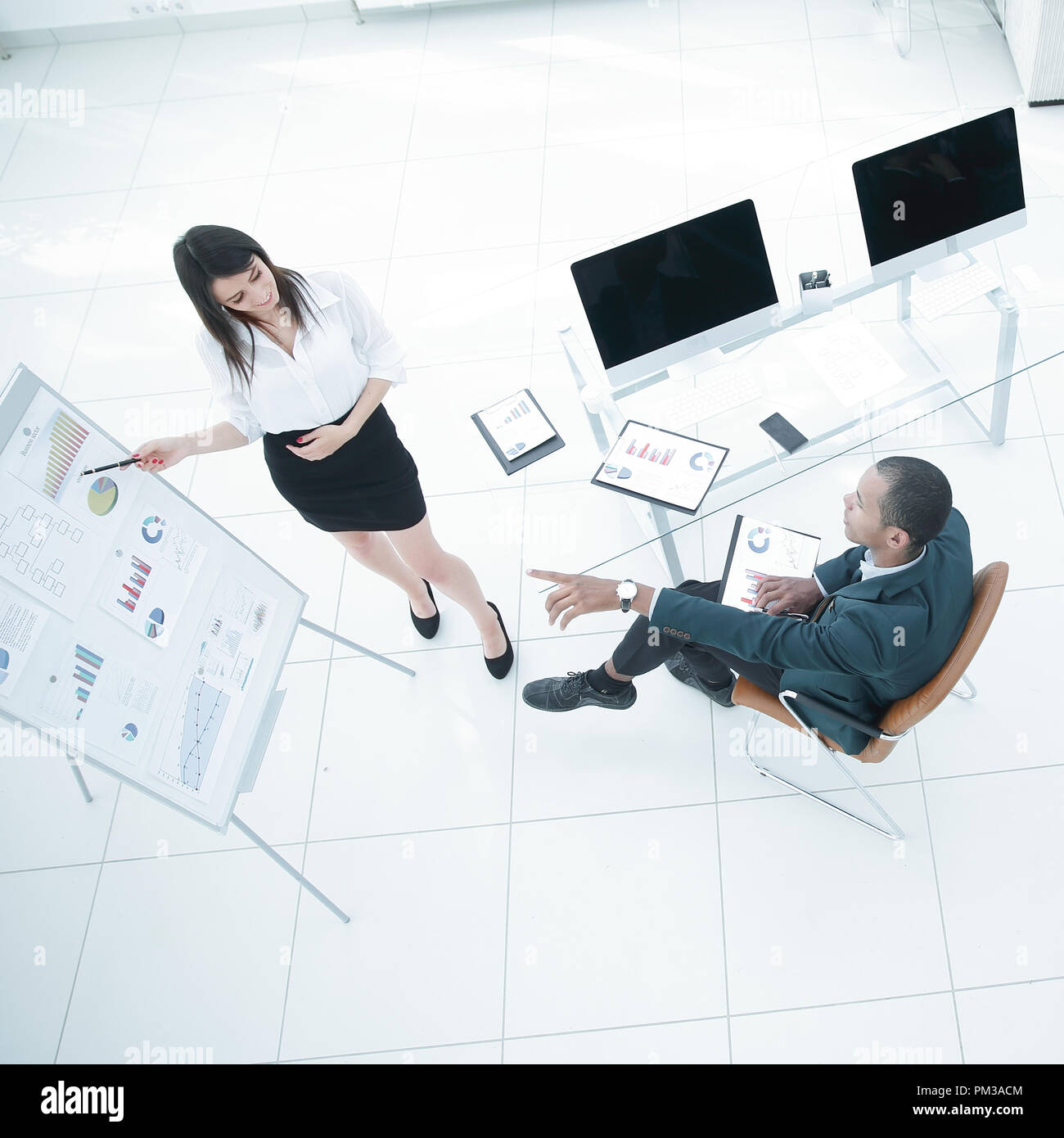 view from the top.young business woman making presentation of a new ...