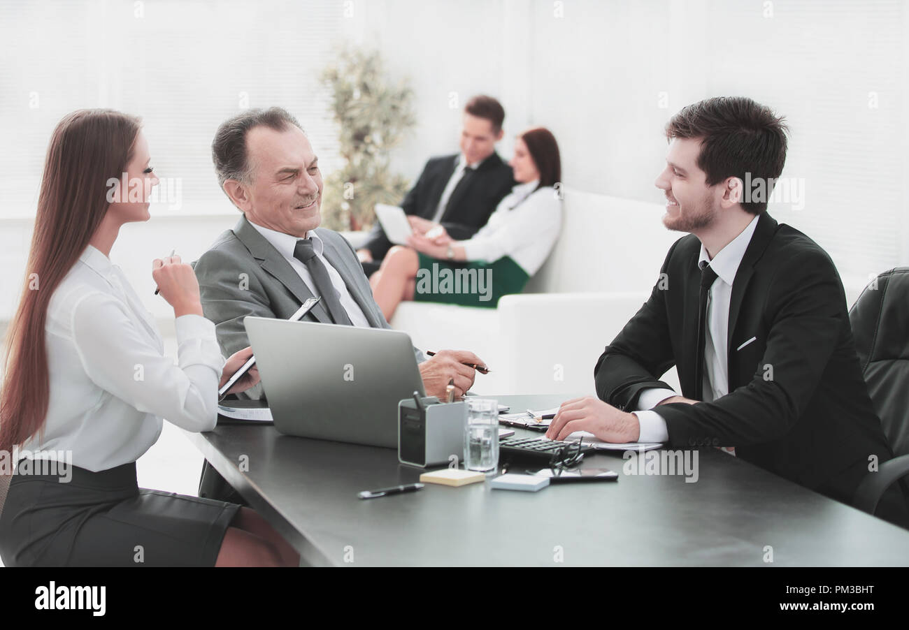 client talking with the staff at the Desk in the office Stock Photo - Alamy