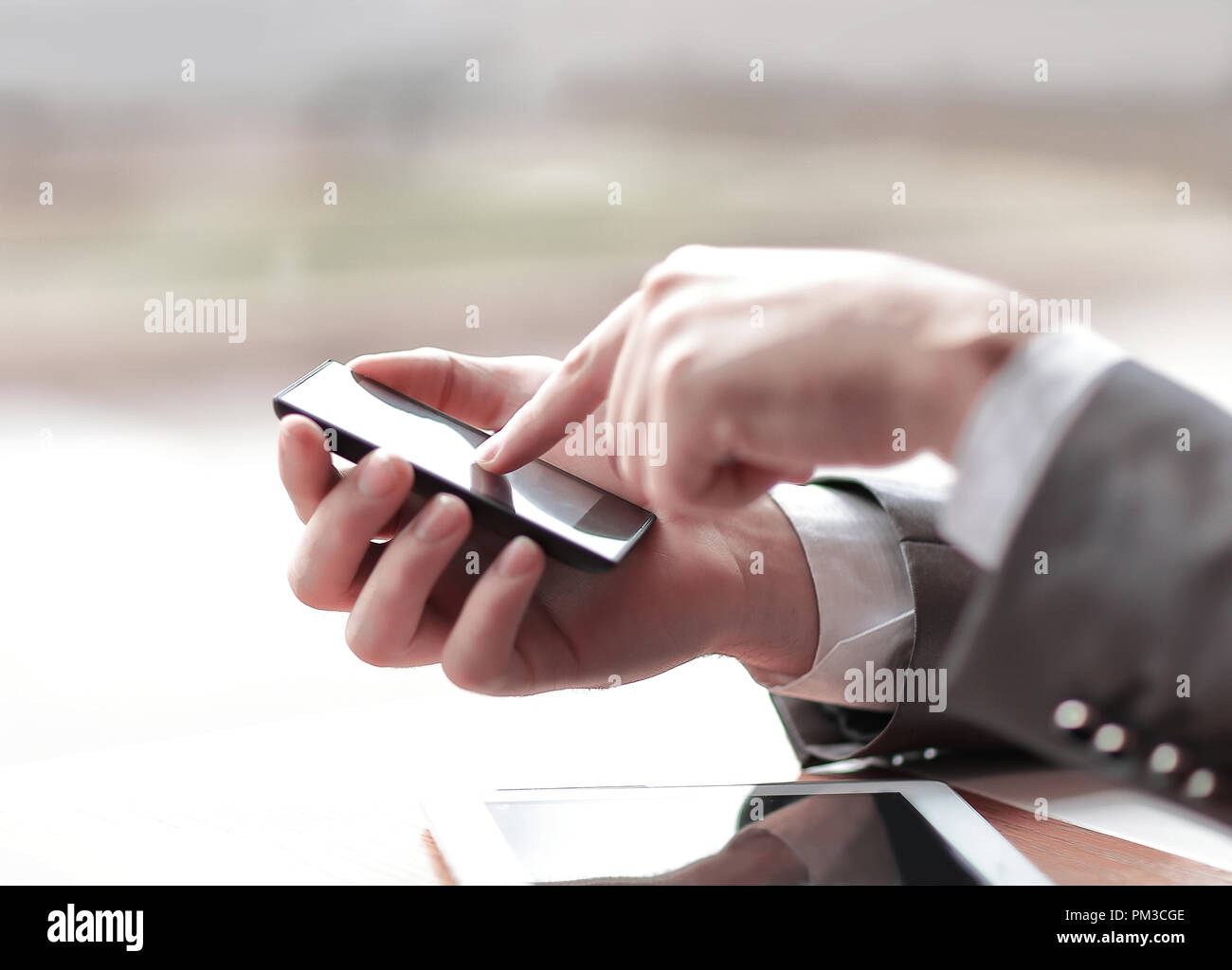 close up.businessman presses his finger on the screen of the smartphone Stock Photo - Alamy