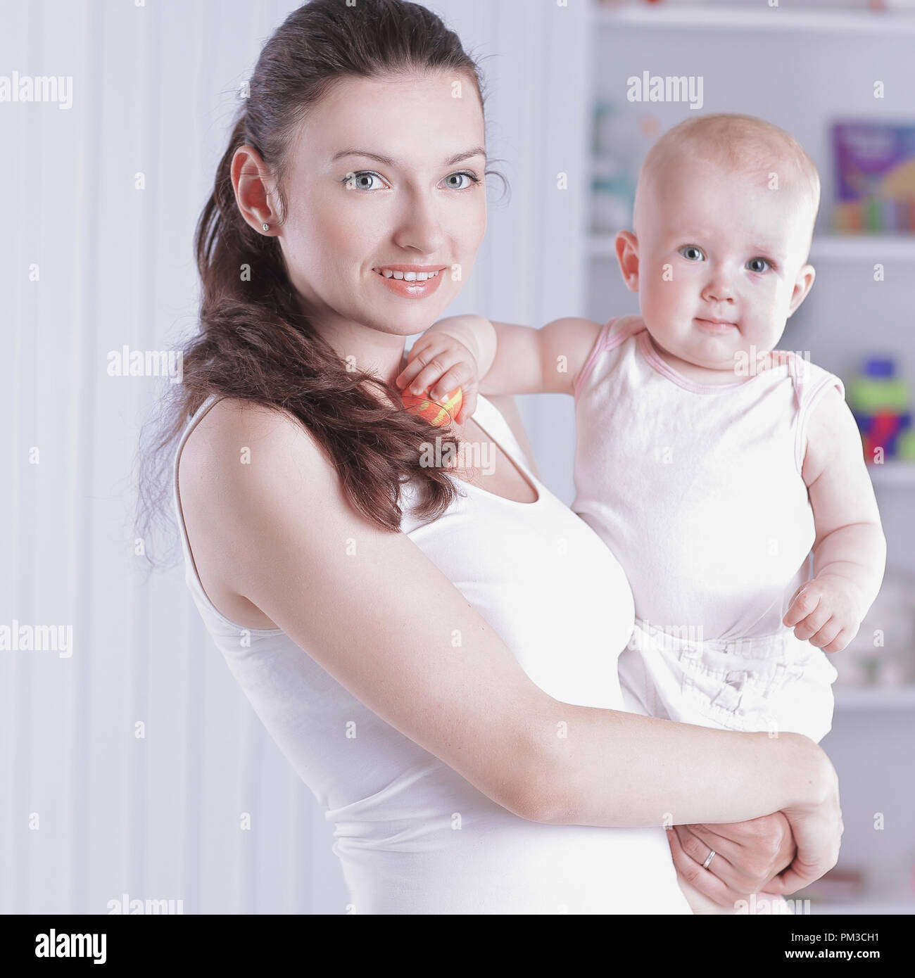 modern young mother with a charming baby Stock Photo - Alamy modern young mother with a charming baby Stock Photo - Alamy