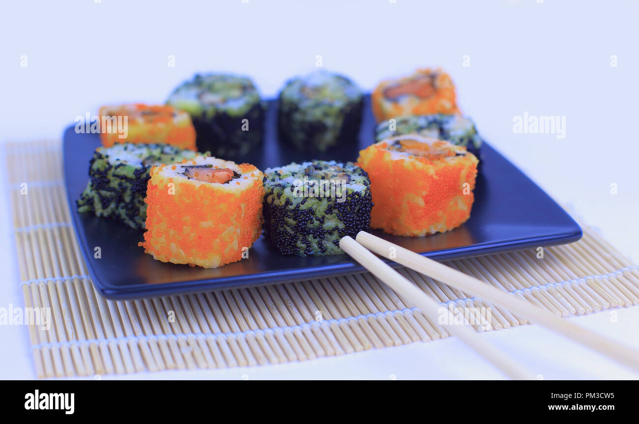 Sushi Set - different types of Maki sushi and chopsticks on a b Stock ...