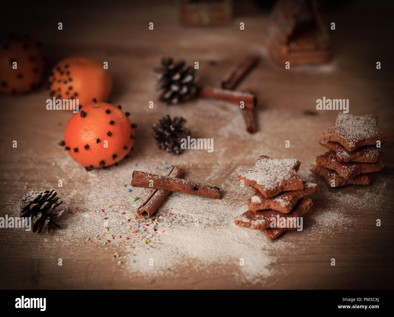 Christmas table. background image of cinnamon sticks,oranges an Stock ...