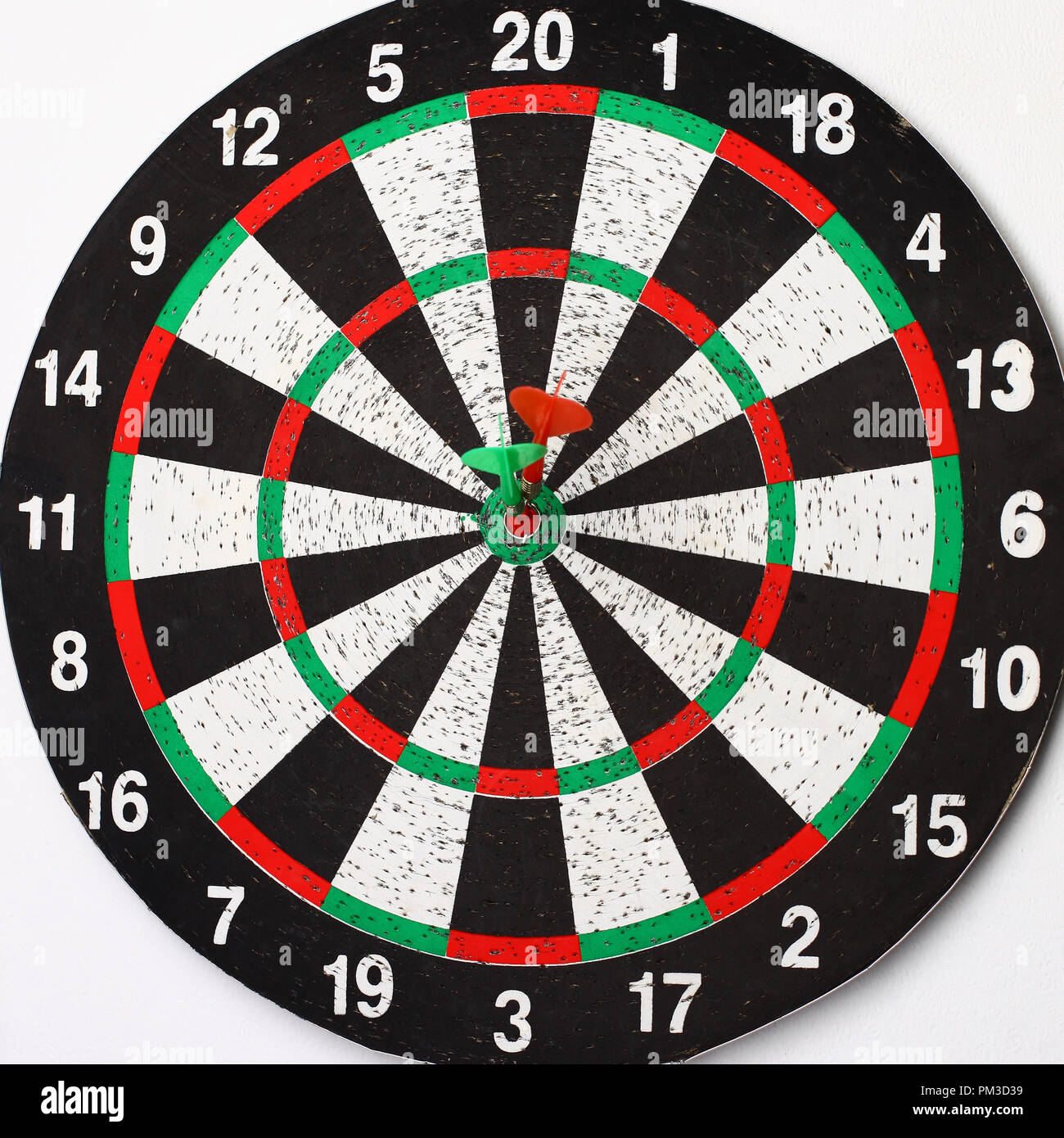 side view.Arrow dart hitting the center of the target dart Board Stock ...