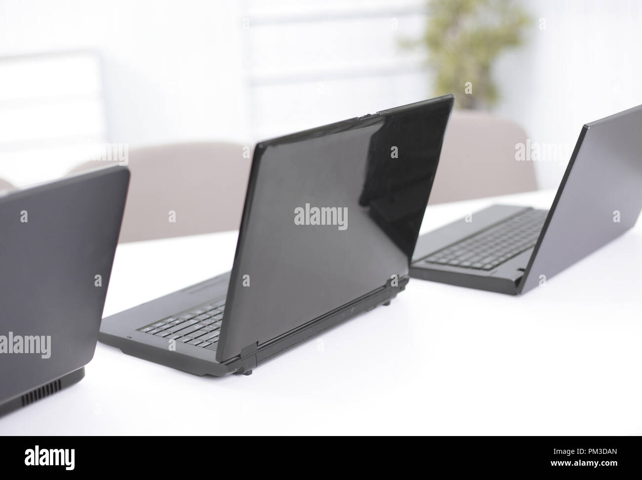 open the laptop on the desktop in a modern office Stock Photo - Alamy