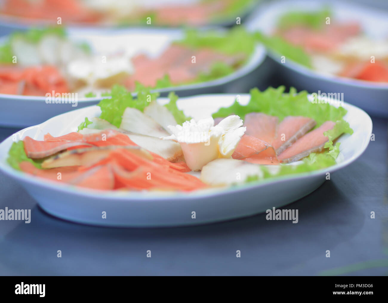 close up.dishes with fish fillet on the kitchen table in the restaurant ...