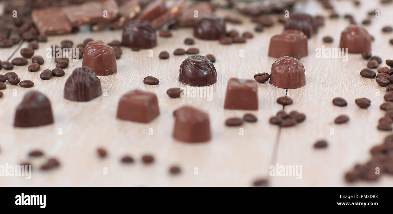 background image of black coffee grain and chocolate candy on wo Stock ...