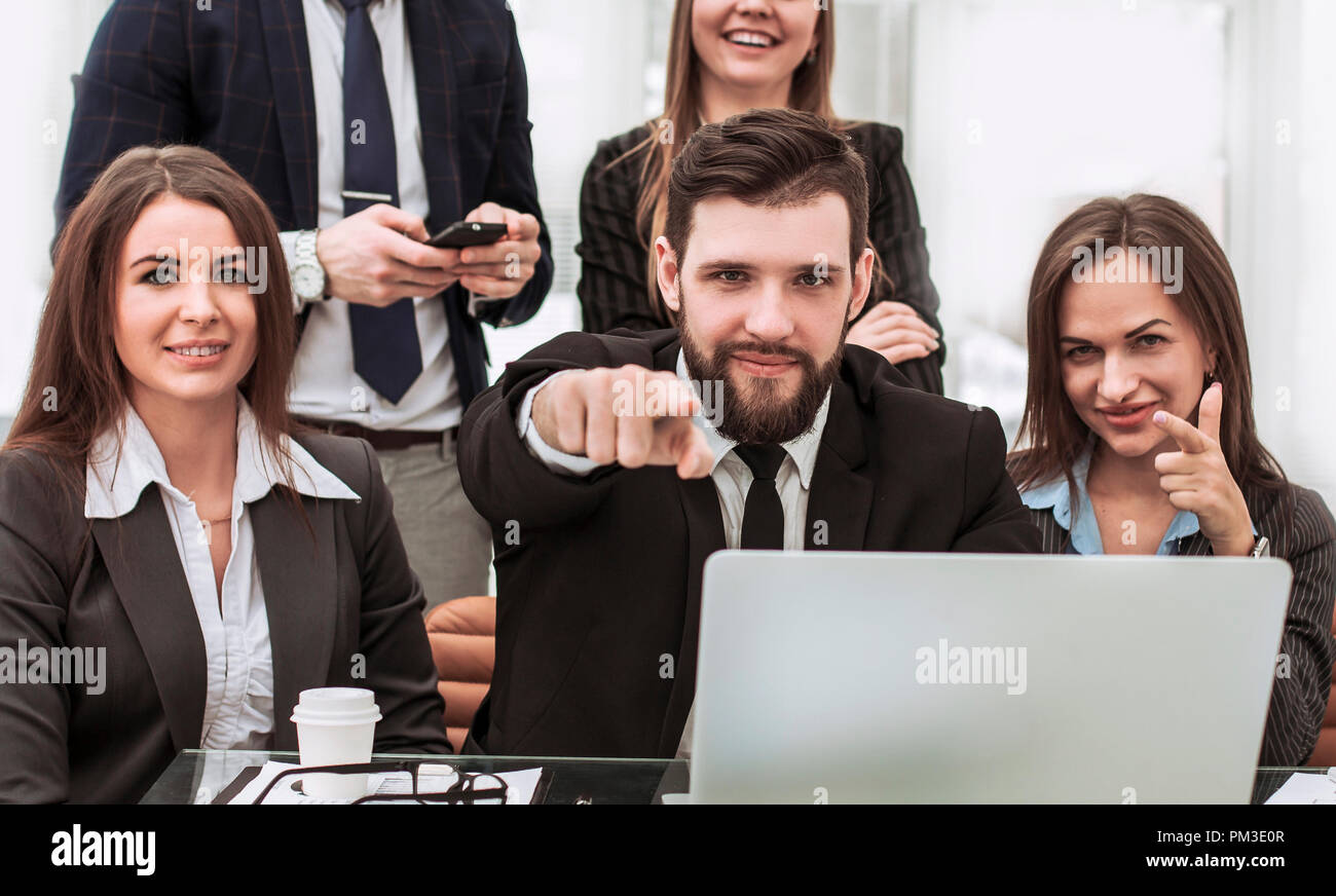 success concept in business - friendly business team showing forefinger ...