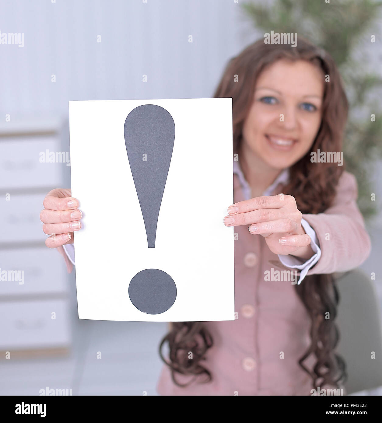 young business woman showing poster with an exclamation point Stock ...