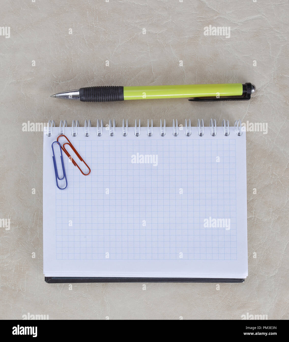 open notebook, paper clip and pen on paper background.photo with copy ...
