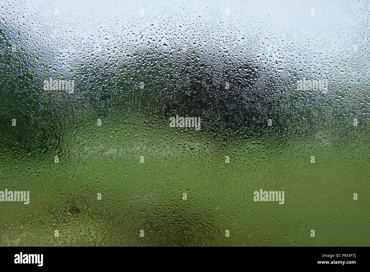 View through rainy window pane on dreary day Stock Photo - Alamy