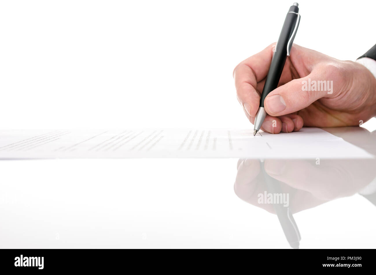 Signing a contract on a white table. With copy space Stock Photo - Alamy