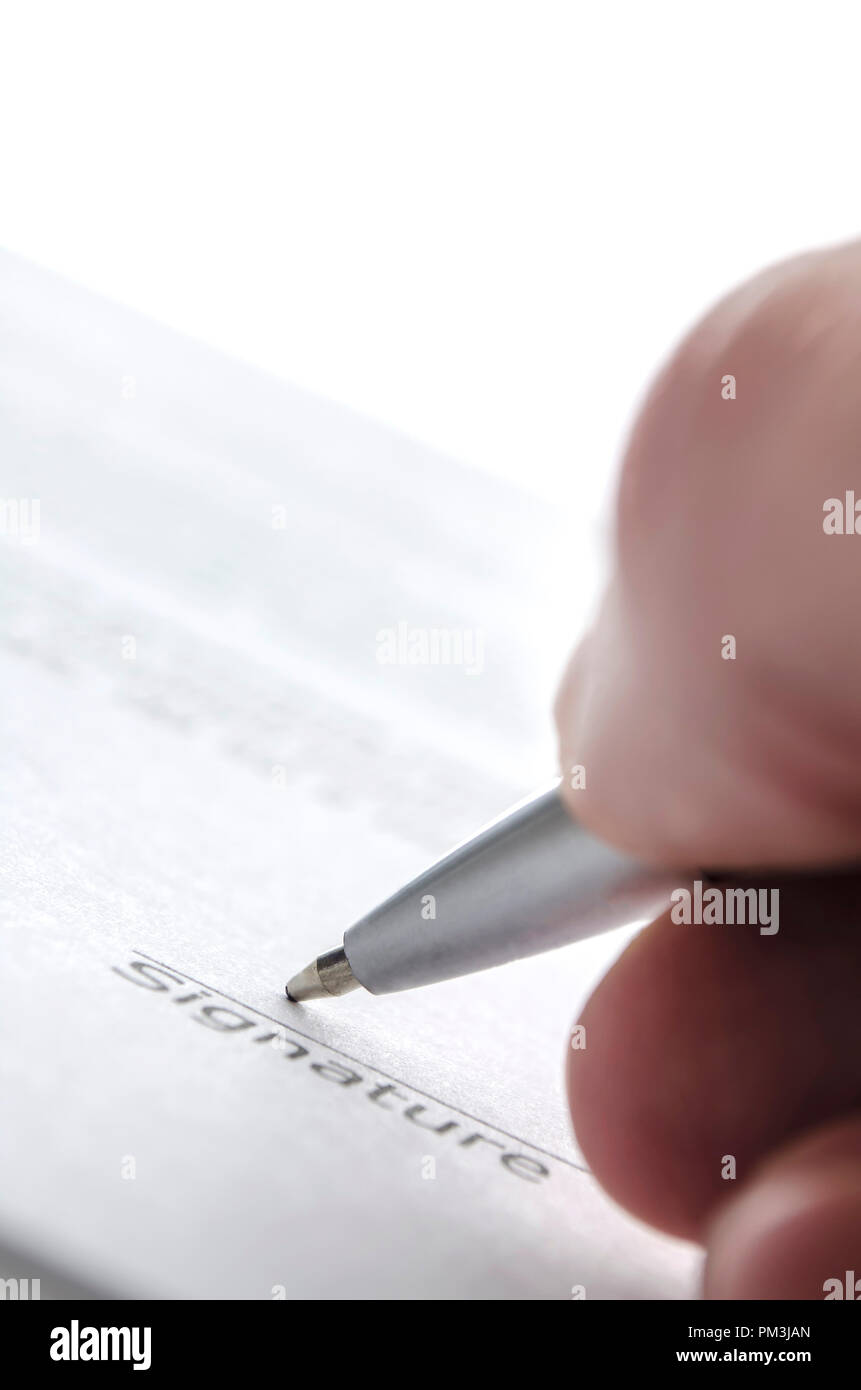 Detail of a signing a contract above signature line Stock Photo - Alamy