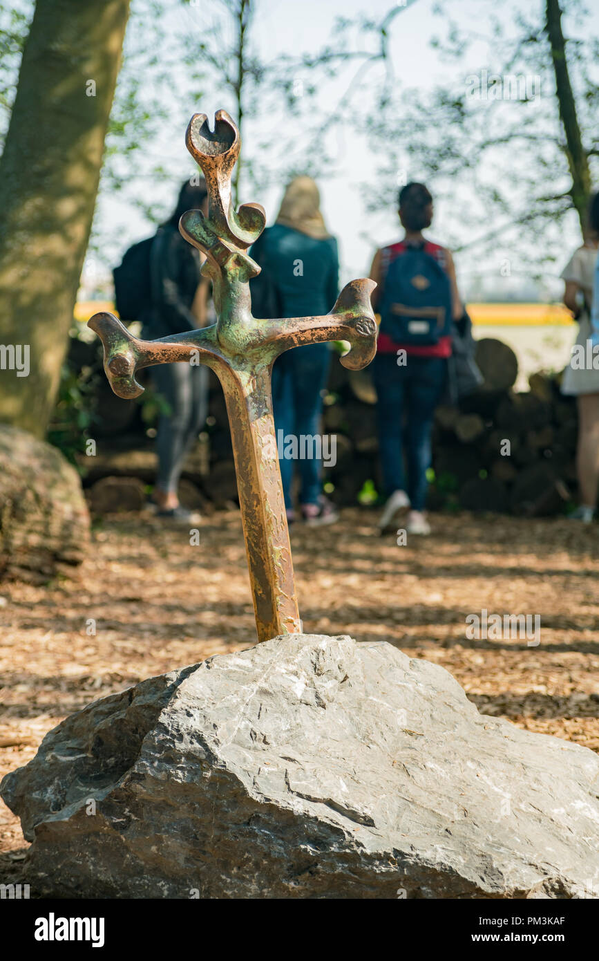 Sword stuck in a stone at Keukenhof, Netherlands Stock Photo - Alamy
