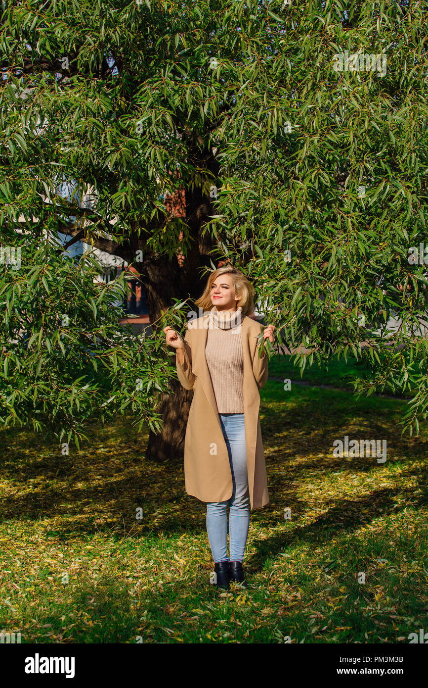 Lady under maple tree hi-res stock photography and images - Alamy