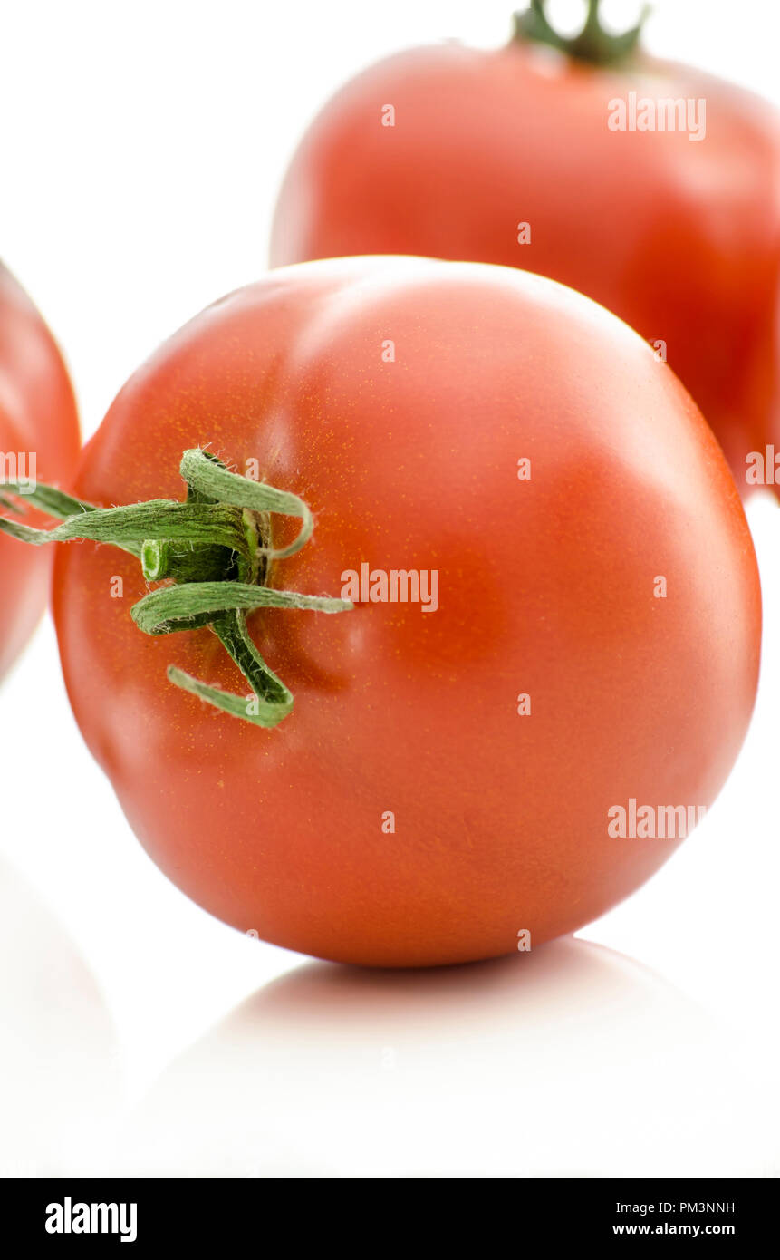 Tomatoes isolated on a white background Stock Photo - Alamy