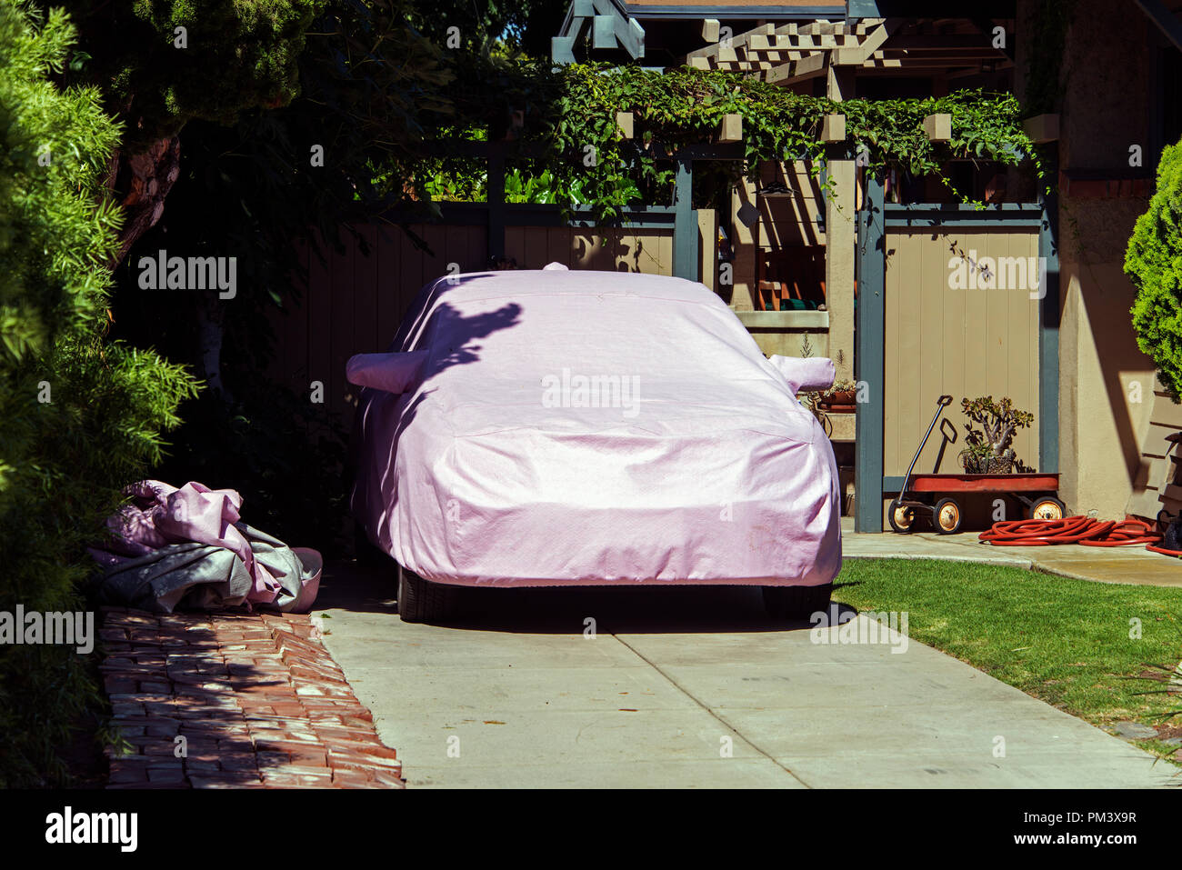 A view of a vintage car with a cover in the street in Venice ...