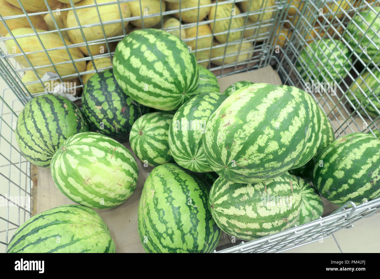 Melons and watermelons in a shop Stock Photo - Alamy