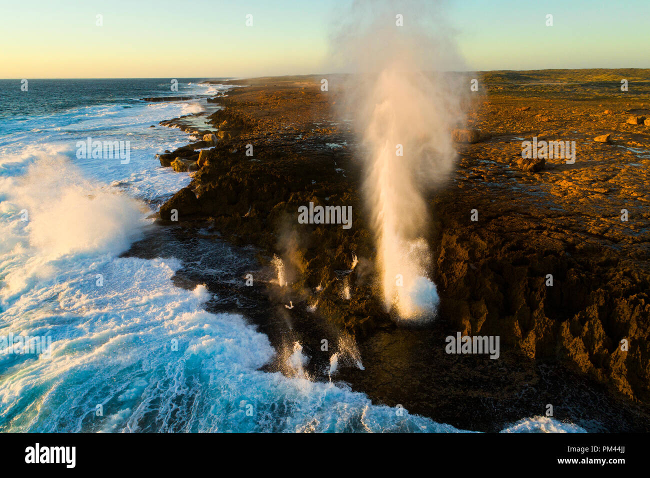 Aerial view of a coastal water spout and a rugged Australian Coastline ...