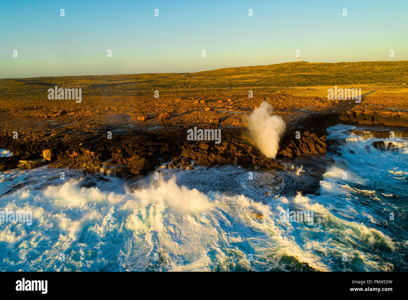 Aerial view of a coastal water spout and a rugged Australian Coastline ...