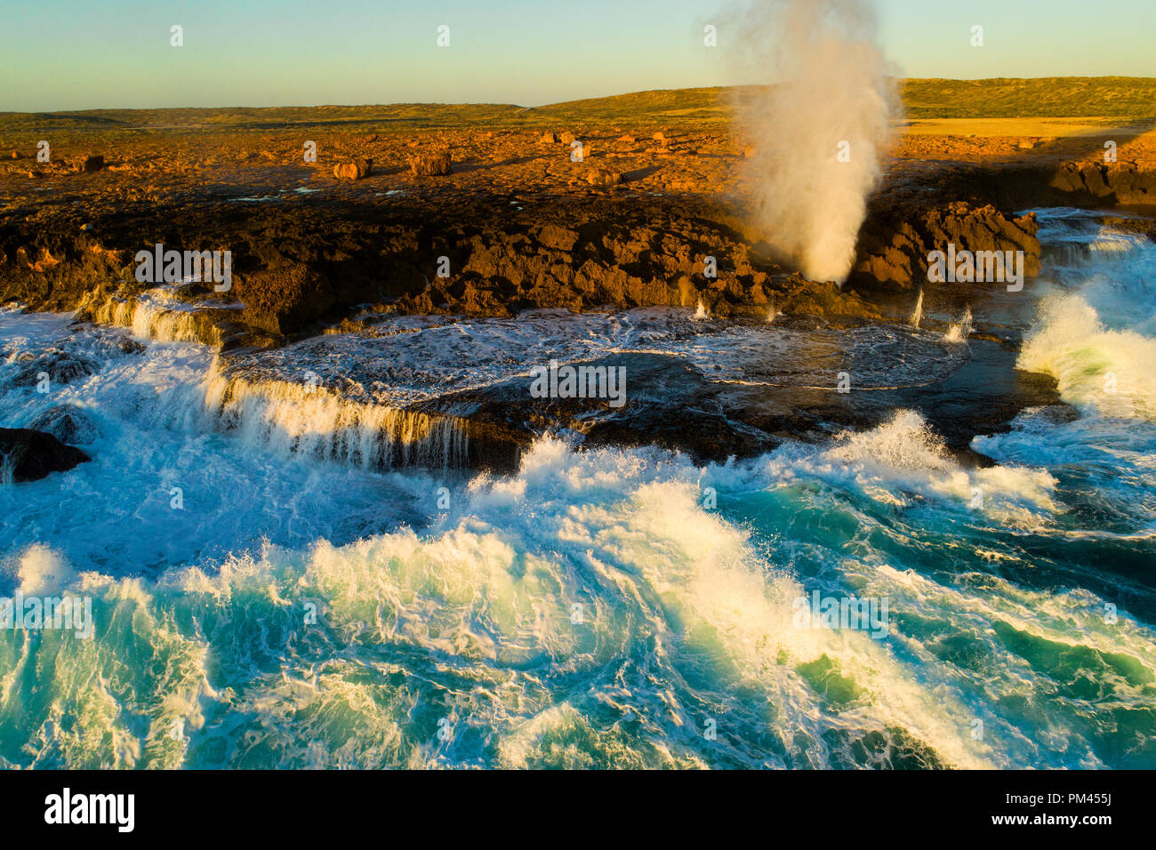 Aerial view of a coastal water spout and a rugged Australian Coastline ...