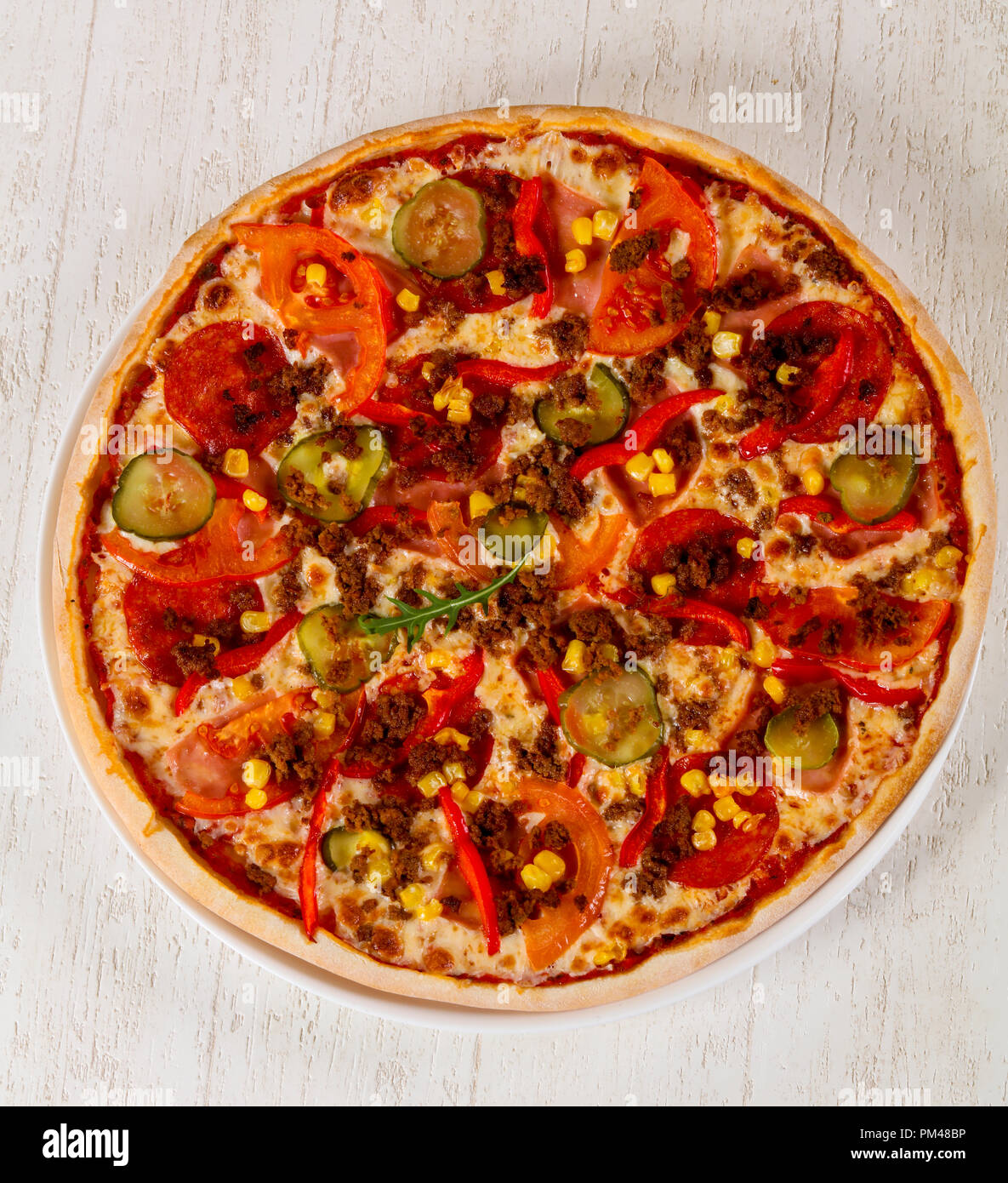 Pizza with minced meat and tomato Stock Photo - Alamy