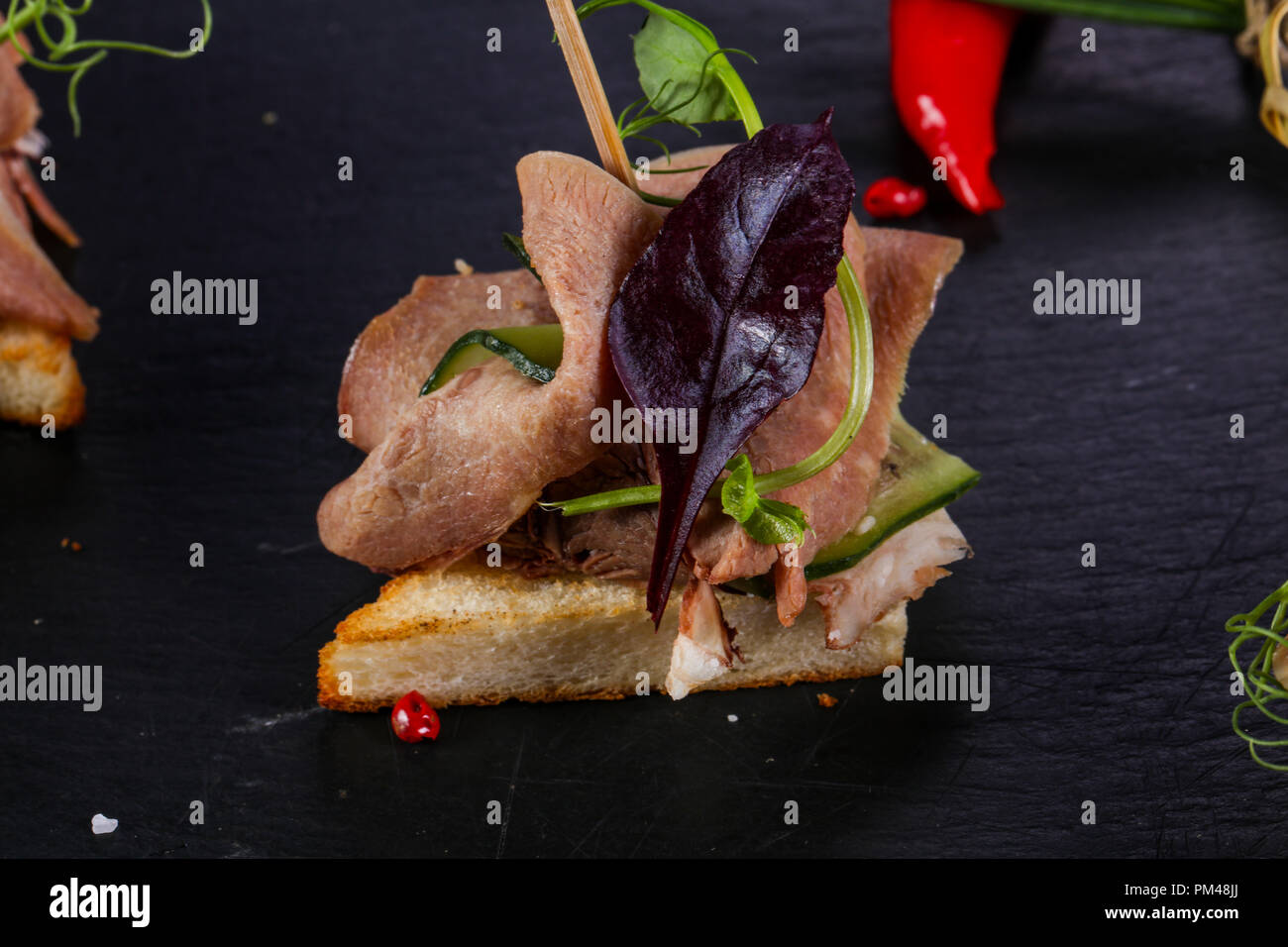 Beef canape served green onion Stock Photo - Alamy