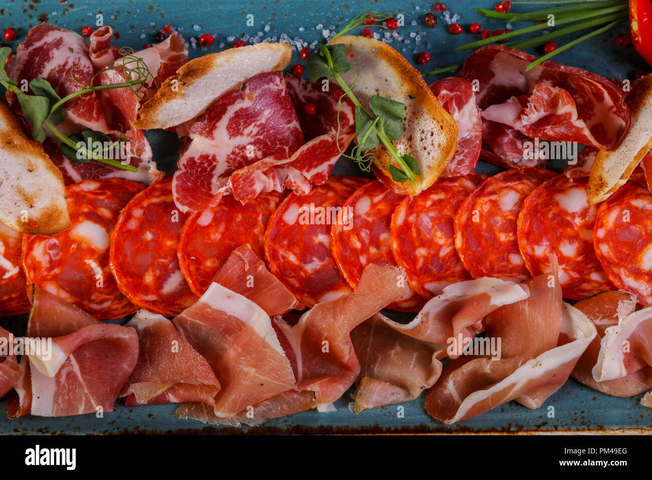 Spanish meat plate - hamon, serrano, chorizzo Stock Photo - Alamy