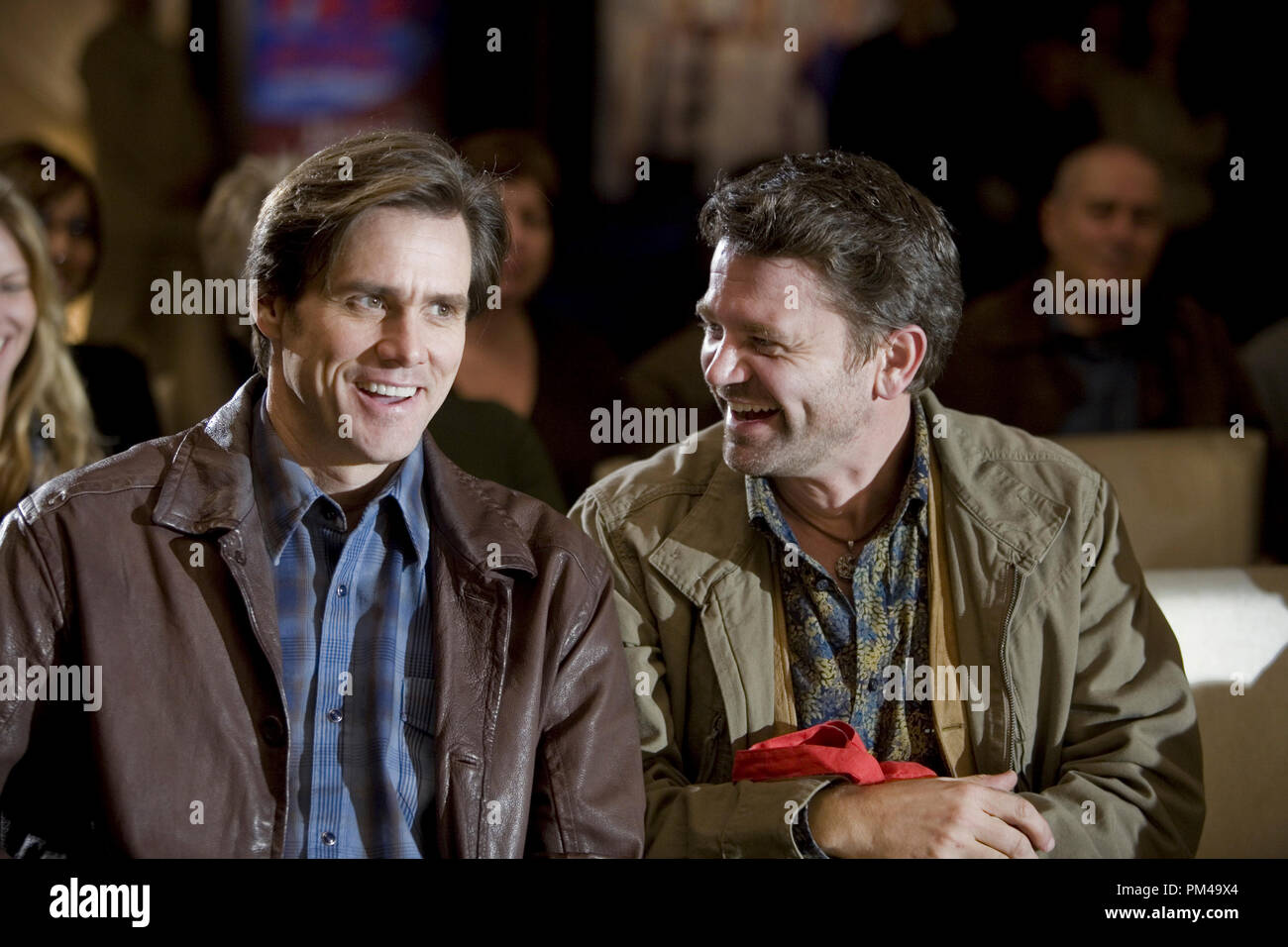 (L-r) Carl (JIM CARREY) and Nick (JOHN MICHAEL HIGGINS) attend the Yes ...