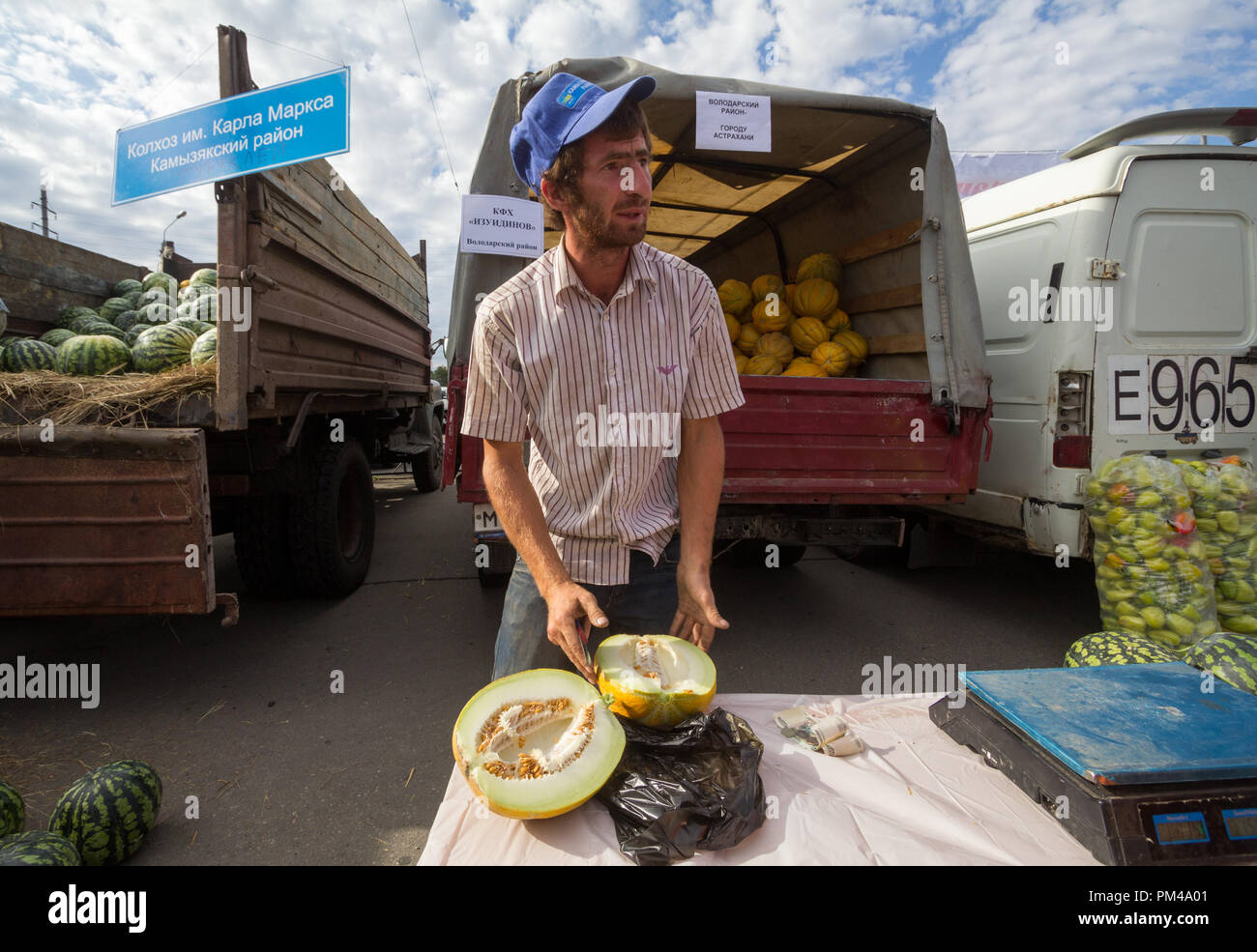 Melons seller at the trade fair in Astrakhan, Russia Stock Photo - Alamy