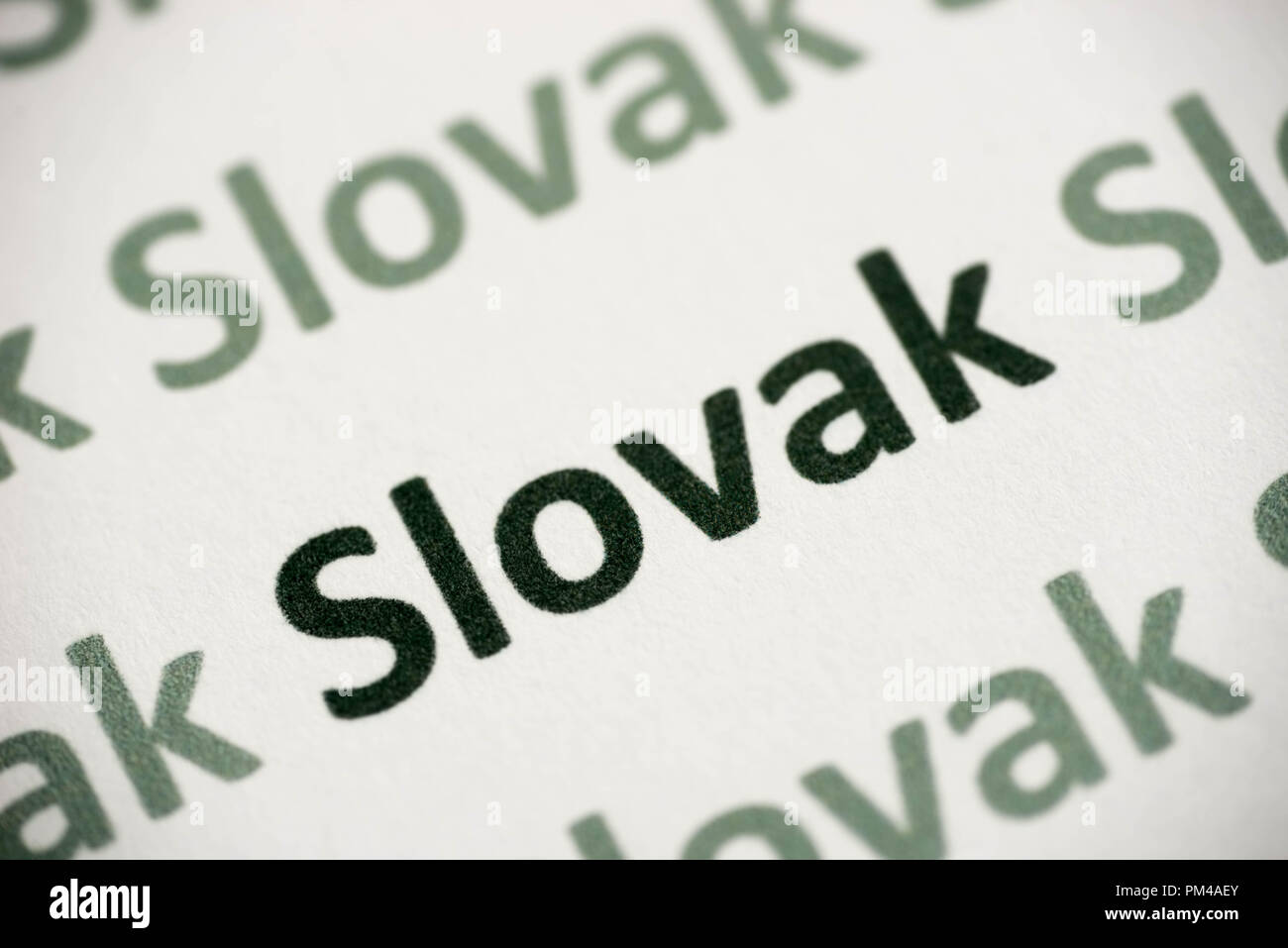 word Slovak language printed on white paper macro Stock Photo - Alamy