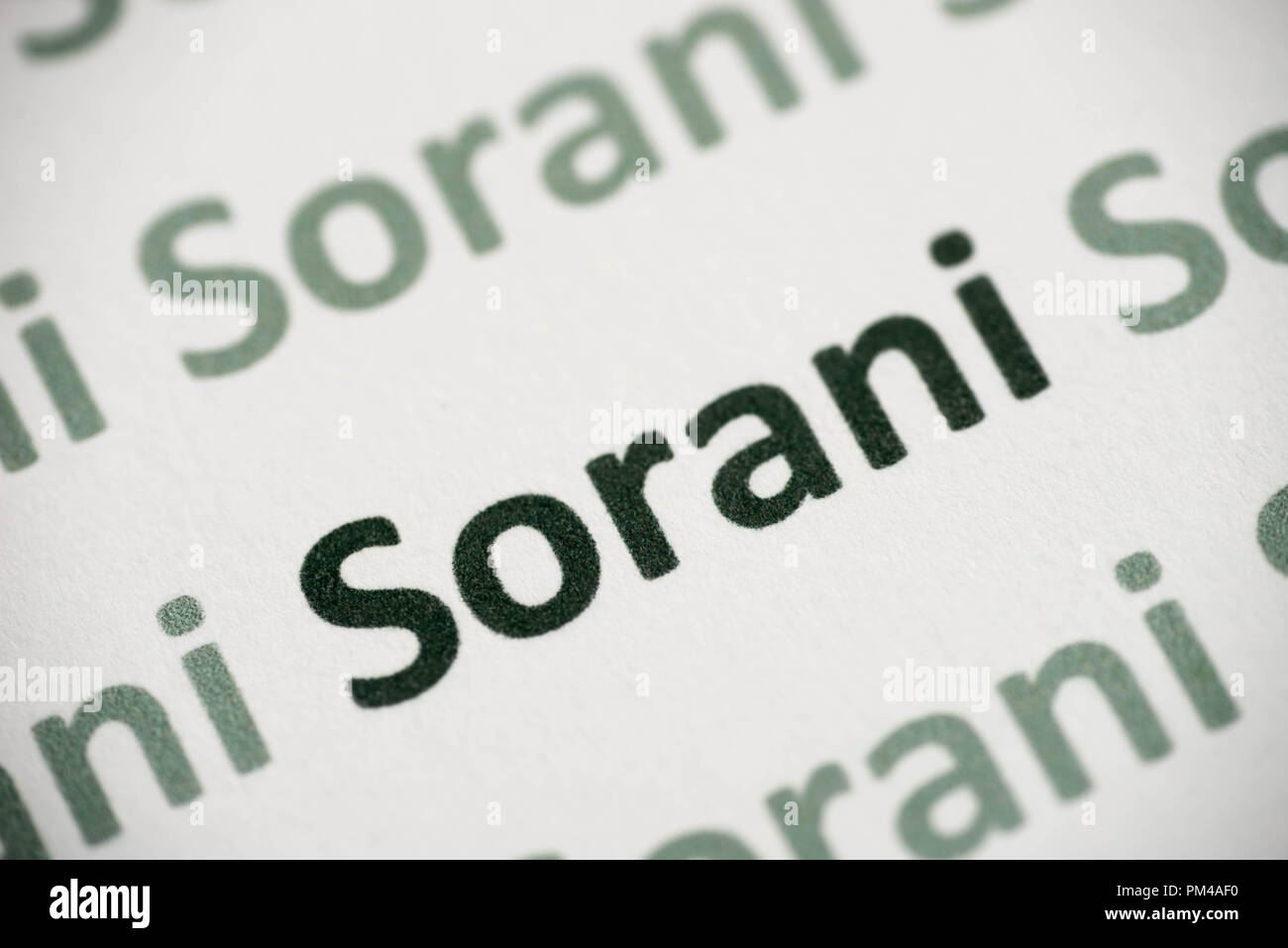 word Sorani language printed on white paper macro Stock Photo - Alamy