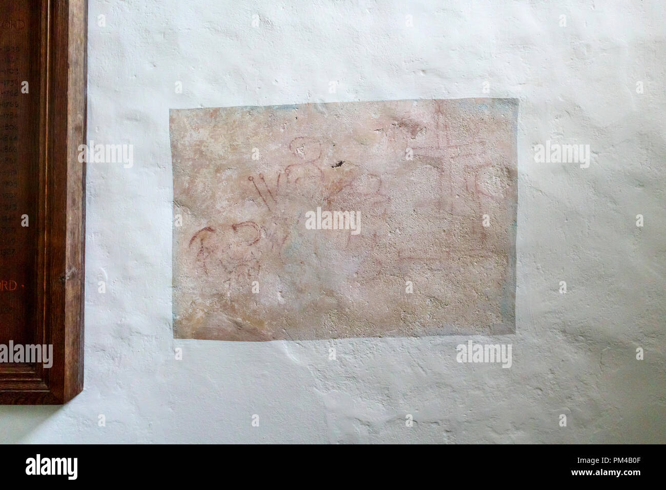 Traces / remnants of an ancient wall fresco painting in historic Wisley ...