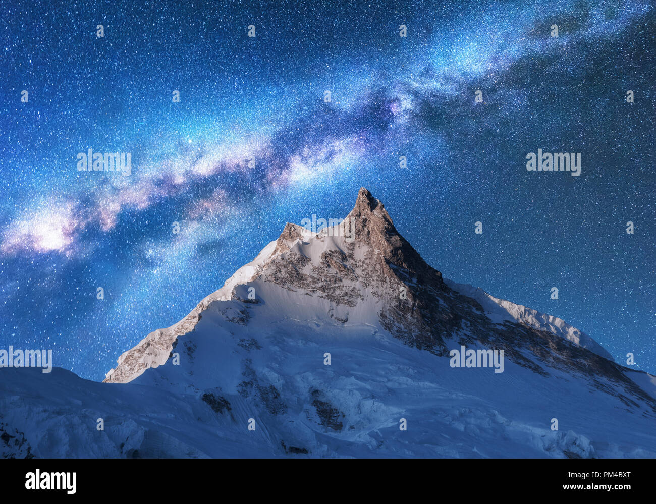 Milky Way above snowy mountains. Space. Fantastic view with snow ...