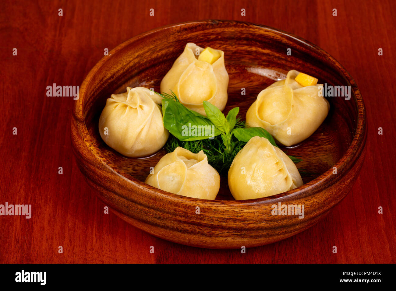 Uzbek traditional dumplings - Manti with meat Stock Photo - Alamy