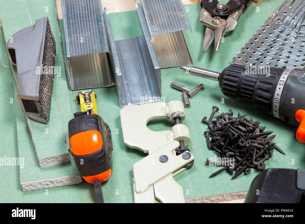 Plasterboard tools set with metal studs, screws, tape measure, screwgun ...